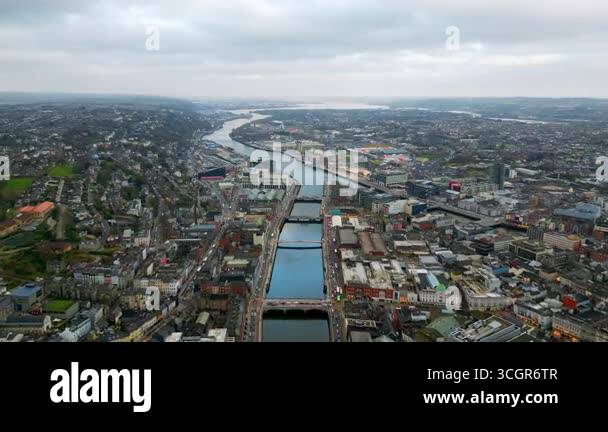 Aerial drone view of Cork City, Ireland, with the River Lee winding ...