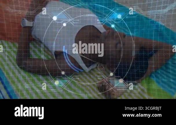 Woman reclining on exercise mat initiating fitness biometric scanning ...