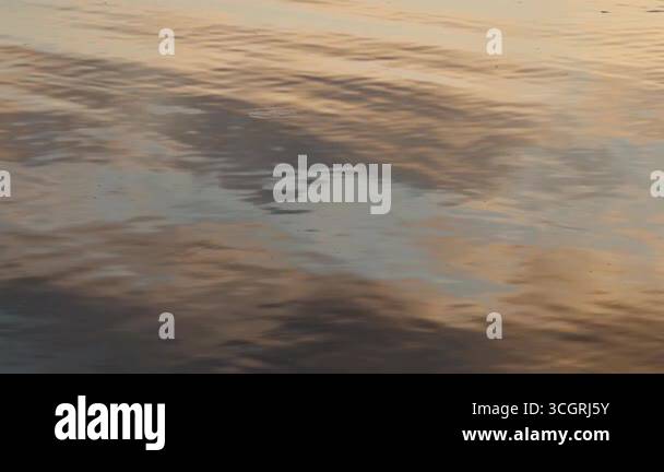 Changing light patterns reflecting on rippling water Stock Video ...