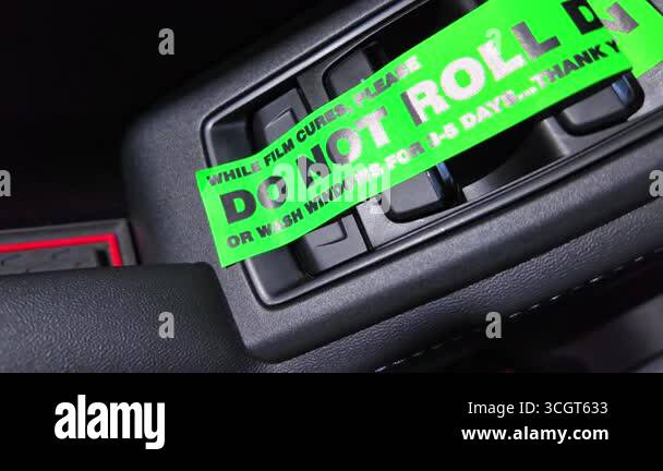 Do not roll down or wash windows, sticker on the vehicle door buttons ...