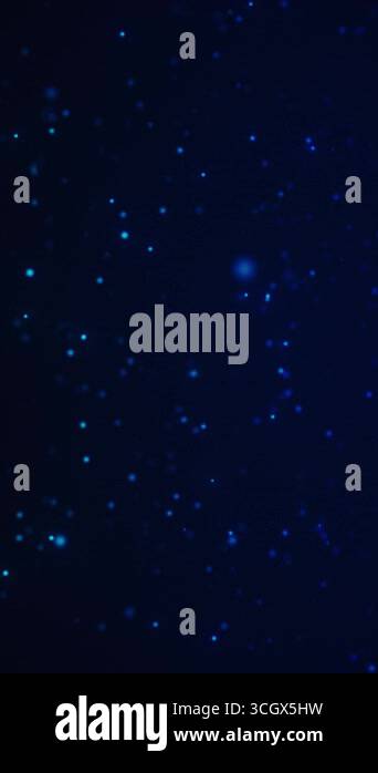 Blue starfield with countless glowing particles drifting through deep ...