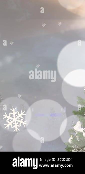 Animation of falling snow over tree with christmas decorations ...