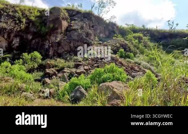 Large rocks have tumbled from the hill. The area is landslide-prone and ...