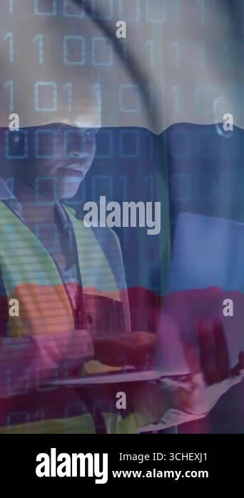 Binary code and flag animation over worker using laptop in industrial setting. Technology ...