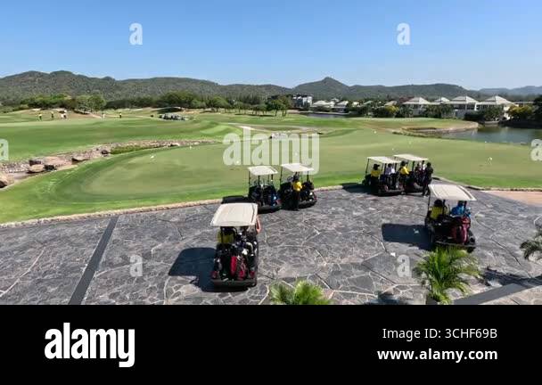 Golf carts moving across a picturesque course Stock Video Footage - Alamy