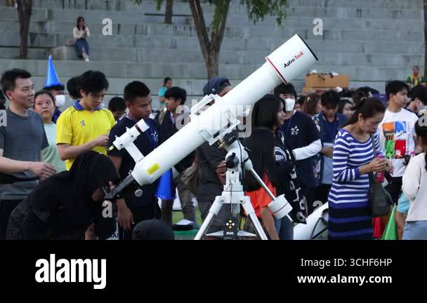 People gather around telescopes for stargazing event Stock Video ...