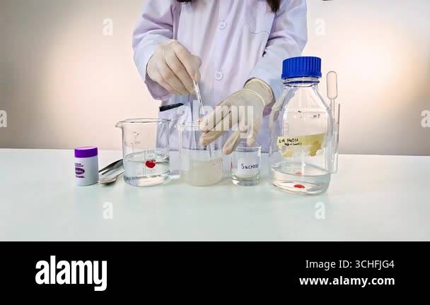 Scientist conducts a color-changing chemical experiment using potassium ...