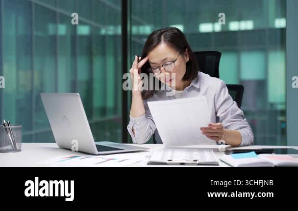 Frustrated asian businesswoman unhappy with bad financial results ...