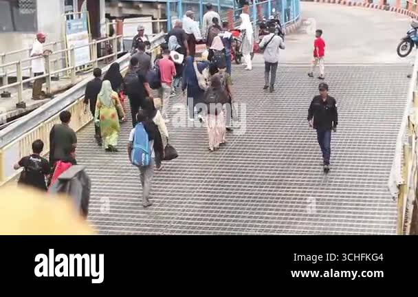 Ferry passengers leave the ship in busy and crowded conditions at the ...