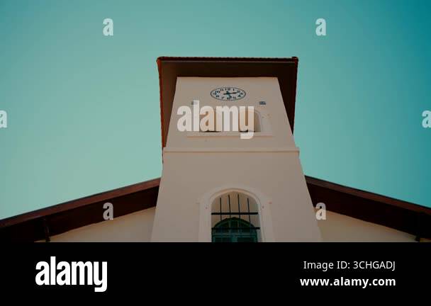 Low angle view of a historic clock tower building with arched window ...