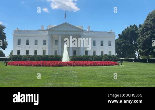 The White House Building view with clear sky and fountain in sunny day ...