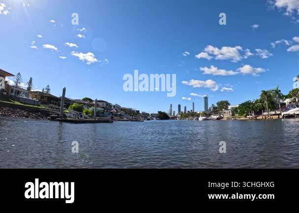 A tranquil boat ride along Gold Coast canal Stock Video Footage - Alamy