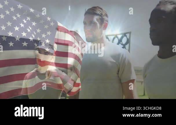 Team members standing on obstacle course, flag waving into view across ...