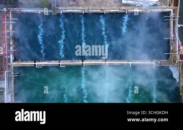 Aerial view of steaming geothermal pools in New Zealand, likely part of ...