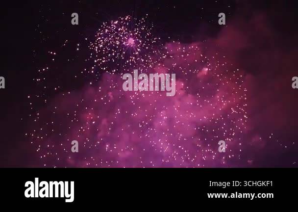 Vibrant fireworks explode in a dazzling night sky, creating a ...