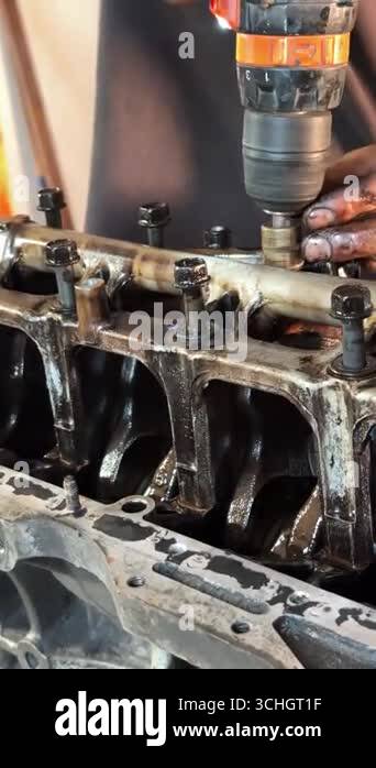 mechanic tightens engine nuts after repair. High quality 4k footage ...