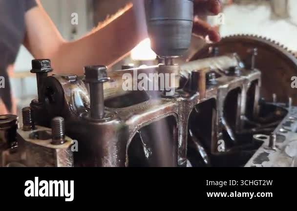 mechanic performing diagnostics, disassembling car engine for ...