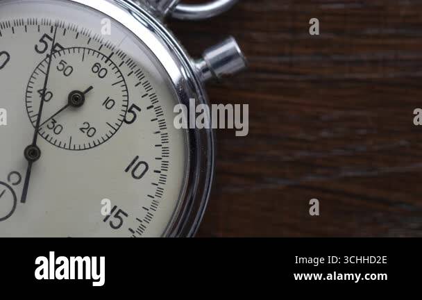 Detail of antique mechanical pocket stopwatch in a metal chrome-plated ...