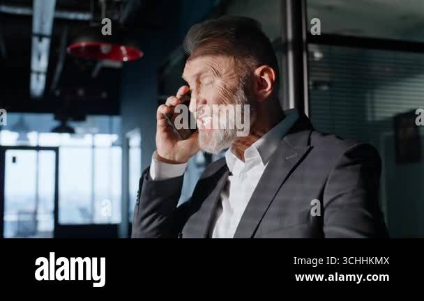 Angry businessman shouting in cellphone standing company hallway ...