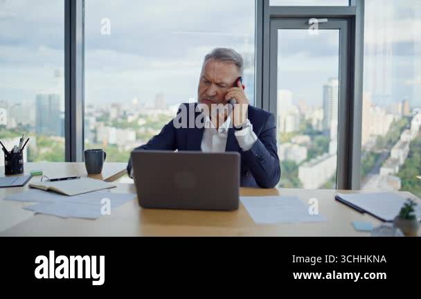 Troubled ceo yelling cellphone looking laptop financial report closeup ...