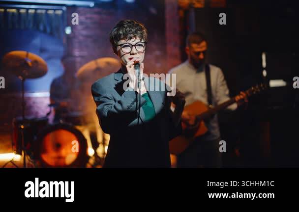 Artistic lady singing microphone at dark modern stage closeup ...