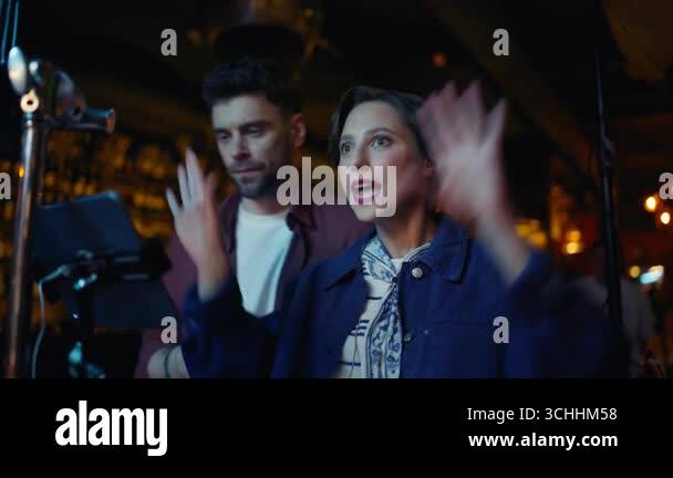 Professional team shooting concert in modern night club closeup. Young ...