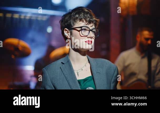Charismatic girl singing nightclub stage closeup. Gorgeous singer in ...