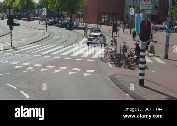 Amsterdam, Netherlands July 29 2025: Amsterdam city intersection with ...