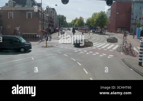 Amsterdam, Netherlands July 29 2025: A busy urban intersection ...