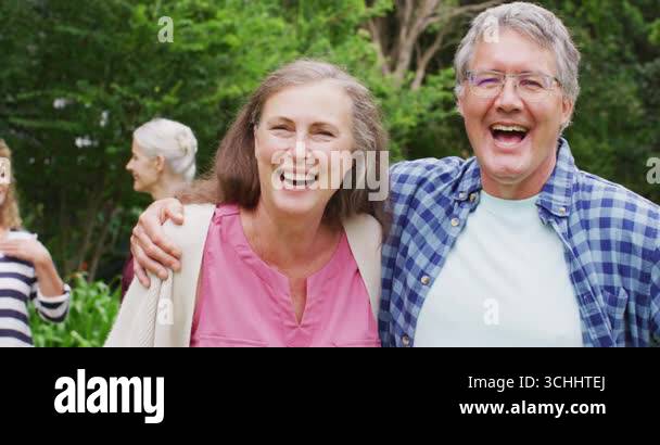 Animation of happy caucasian female and male senior friends embracing ...