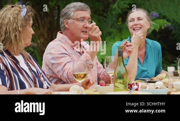 Animation of happy caucasian senior female and male friends talking at ...