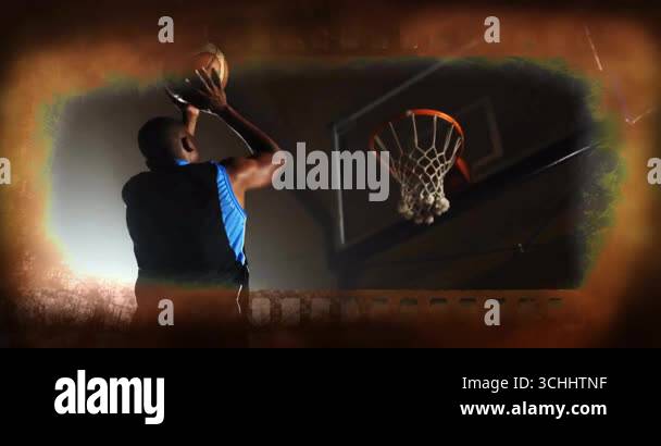 Athlete cradling basketball at free-throw line in gym initiating ...