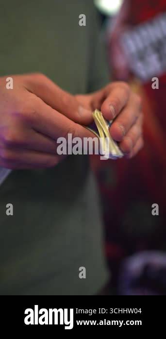 Hands are engaged in the meticulous task of sorting and organizing ...