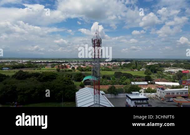 Aerial drone shot of 4G 5G communication tower over green landscape ...