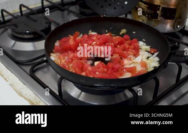 Frying Tomato and Onion in Pan, Cooking Vegetables on Stove for ...