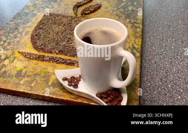 unique creative approach, coffee beans and a cup of aromatic coffee ...
