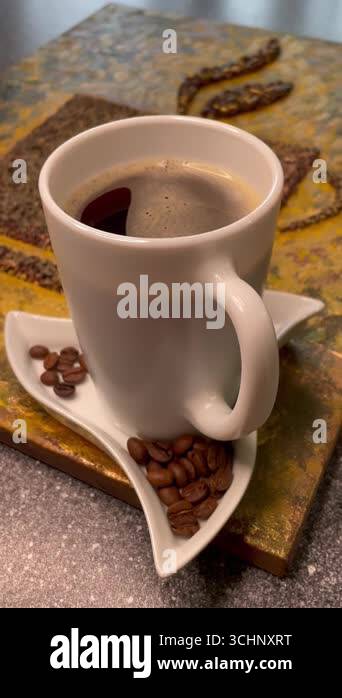 unique creative approach, coffee beans and a cup of aromatic coffee ...