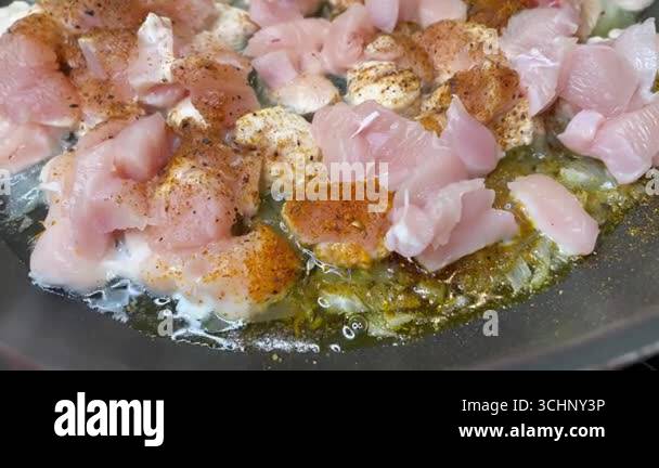 Chicken fillet fried in spices in oil in a frying pan Stock Video ...