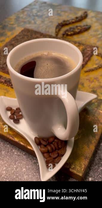 unique creative approach, coffee beans and a cup of aromatic coffee ...