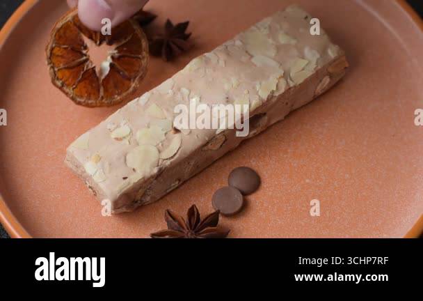 Nougat or white caramel with hazelnuts and pistachios and citrus pieces ...