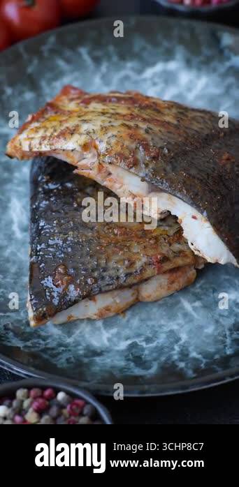 Food, seafood, grilled fish fillet with lemon, salt and spices. Grilled ...