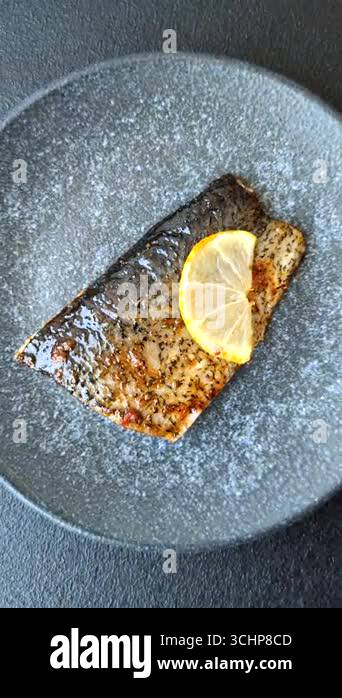 Food, seafood, grilled fish fillet with lemon, salt and spices. Grilled ...