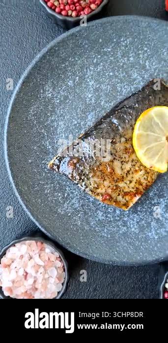 Food, seafood, grilled fish fillet with lemon, salt and spices. Grilled ...