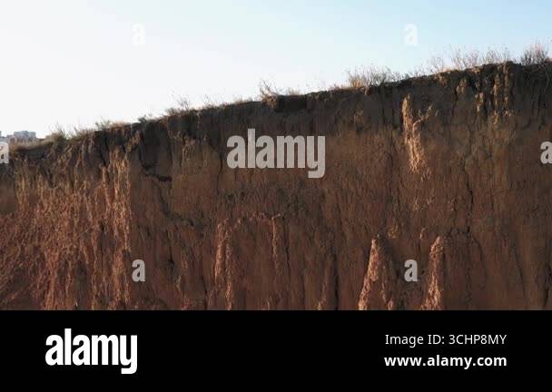 Geological cut of working ground wall cliff. East Europe residental ...