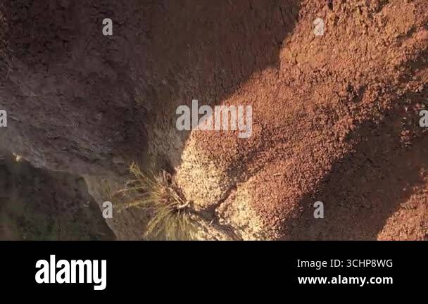 Flying over geological cut of working ground wall or board in ...