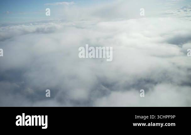 Clouds floating in clean blue sky Stock Video Footage - Alamy
