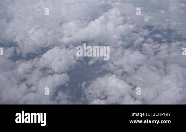 Clouds floating in clean blue sky Stock Video Footage - Alamy