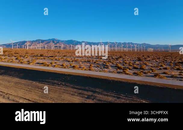 Cinematic drone footage flying smoothly forward across the arid desert ...