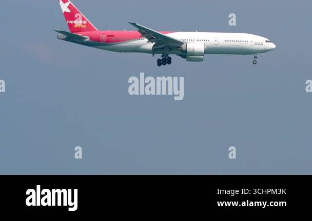 PHUKET, THAILAND - JANUARY 20, 2025: Wide-body plane of Ikar Boeing 777, RA-73272 landing at ...