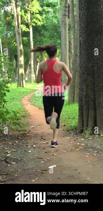 Runner running woman jogging in Taipei city Daan park. Exercising Asian ...